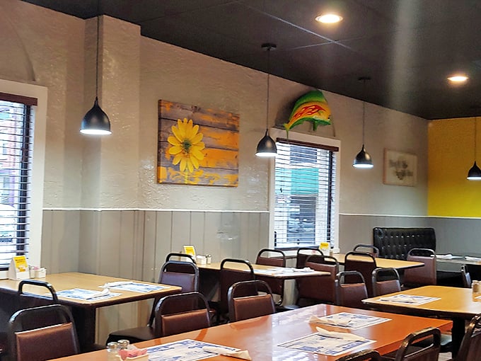 Sunflower art and cheerful yellow accents create that "grandma's dining room but cooler" vibe that makes you instantly feel at home.