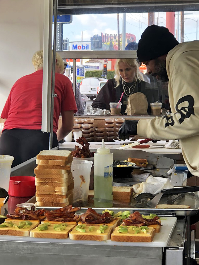 Breakfast alchemy in action. Watching these sandwiches being assembled is like seeing Michelangelo paint the Sistine Chapel, except you can eat the masterpiece afterward.