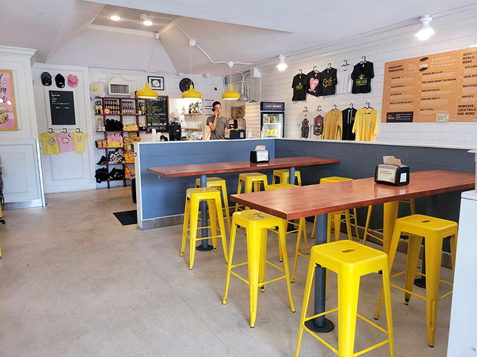 Cheerful yellow stools against blue-gray walls create the perfect backdrop for morning magic. Simple, stylish, and ready for sandwich worship.