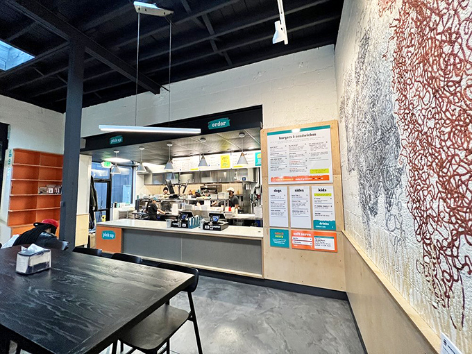 Industrial chic meets culinary workshop. The open kitchen design lets you witness the burger alchemy happening before your very eyes.