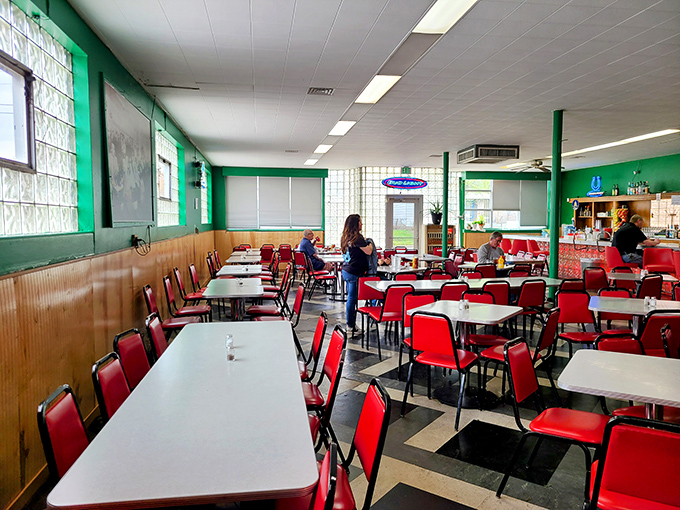 Red vinyl chairs and green walls create a diner atmosphere that hasn't changed in decades. No Instagram filters needed&mdash;this is the real deal.