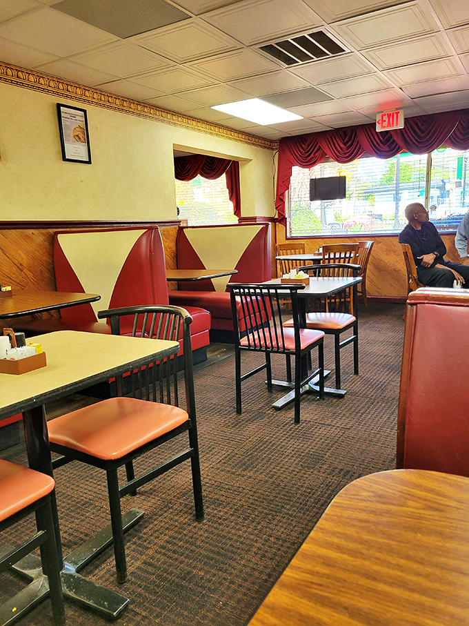Red vinyl booths that have cradled generations of Atlanta diners. No designer needed to tell them comfort never goes out of style.