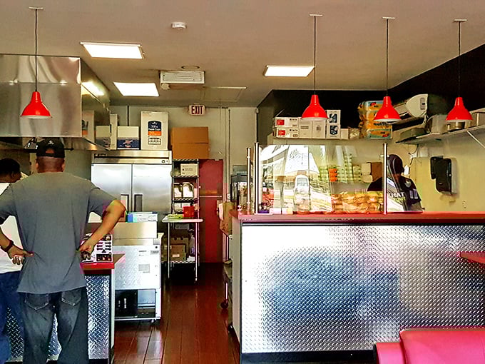 Inside, the compact space buzzes with anticipation. Those red pendant lights aren't just for show&mdash;they're beacons guiding hungry pilgrims to burger nirvana.
