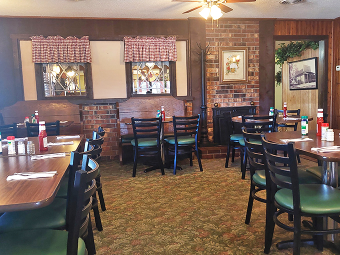 Red-checkered curtains and wood-paneled walls tell you this place means business. No fancy frills, just decades of chicken-frying wisdom awaiting your taste buds.