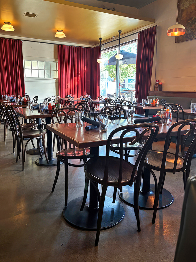 Red curtains and bentwood chairs create an atmosphere that's both homey and hip&mdash;like your coolest aunt's dining room.
