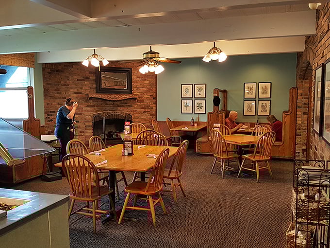 Wooden chairs, brick walls, and that fireplace&mdash;this isn't just dining, it's a warm hug disguised as a restaurant.