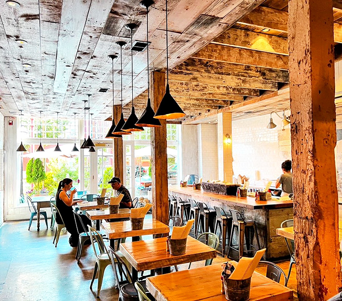 Rustic meets refined in Peacemaker's dining room, where reclaimed wood beams and industrial lighting create an atmosphere as authentic as the seafood.