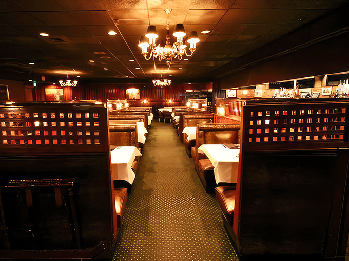 Step inside and you're transported to an era when dining meant something. Those booth dividers aren't just furniture&mdash;they're privacy directors for your food affair.