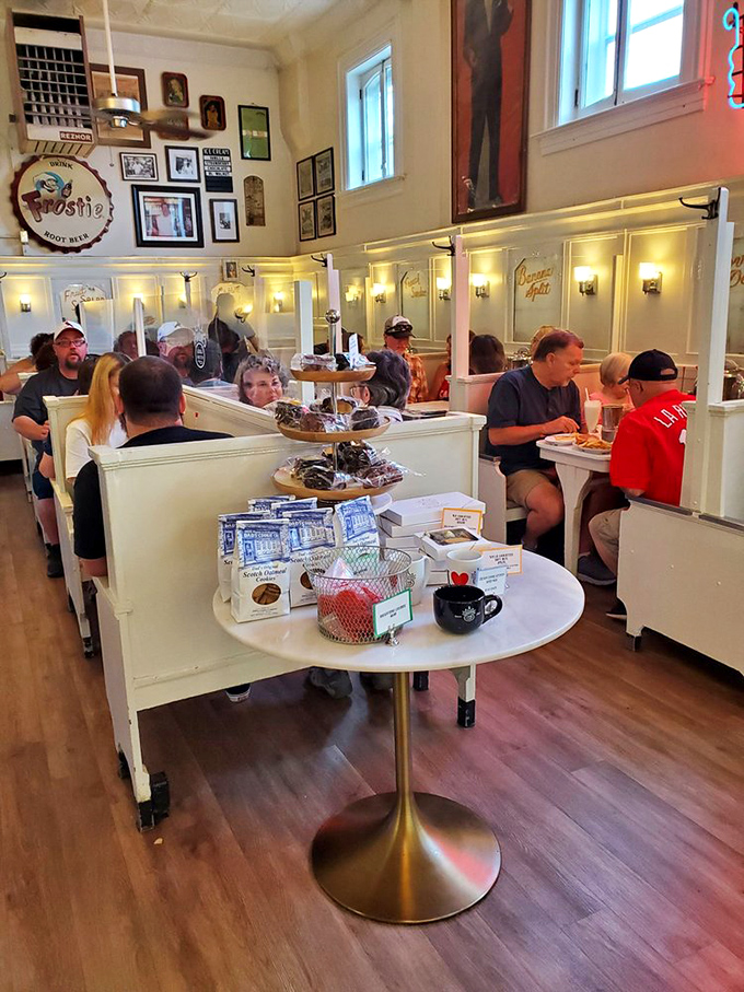 Original wooden booths and period details transport diners back to simpler times when conversations happened face-to-face.