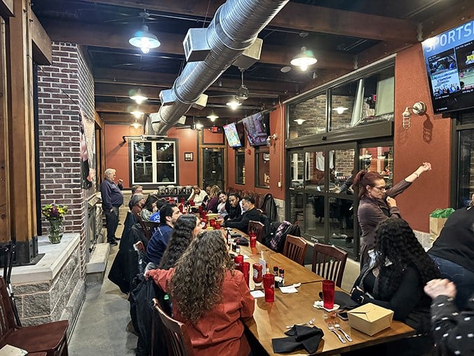 Where carnivores gather. The exposed ductwork and warm terracotta walls create that perfect "come as you are, leave fuller than you arrived" vibe.