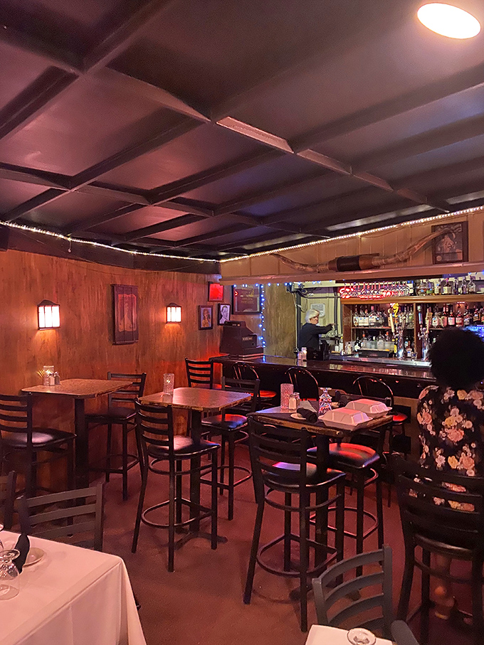 Step inside and time stands still. The warm wood paneling, intimate lighting, and classic bar create an atmosphere where Frank Sinatra would feel right at home.