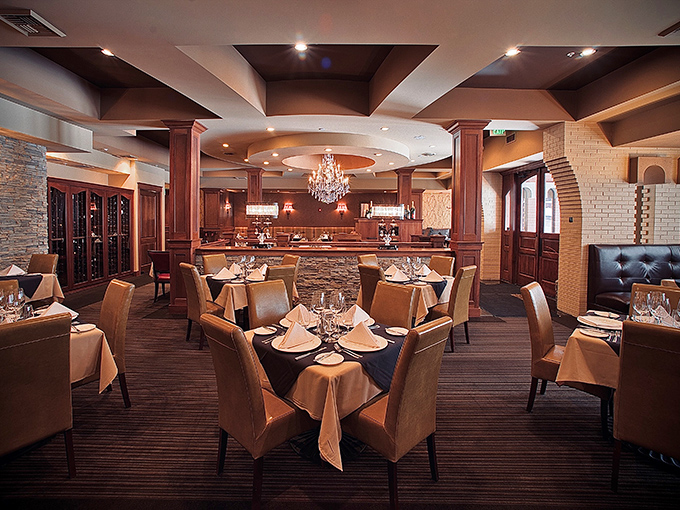 Classic steakhouse elegance meets unpretentious comfort in Churchill's dining room. The chandeliers say special occasion, but the atmosphere whispers "relax and enjoy."