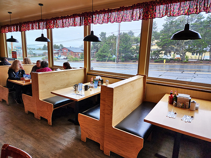 Simple wooden booths with large windows create the perfect stage for culinary magic to unfold. Comfort with a view!