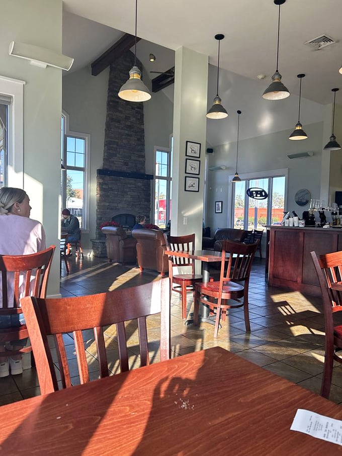 Soaring ceilings, stone fireplace, and those leather chairs that practically whisper "stay awhile." This isn't just a coffee shop&mdash;it's your new favorite living room with better food.