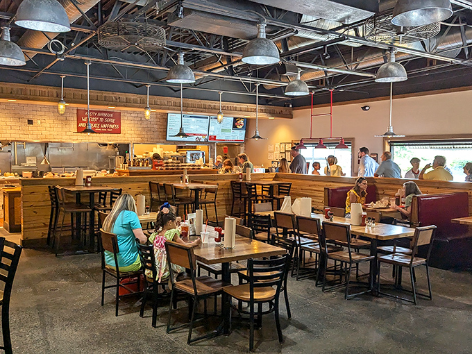 Industrial meets homestyle in this dining room where the only thing more appealing than the pendant lighting is the promise of what's coming from the kitchen.