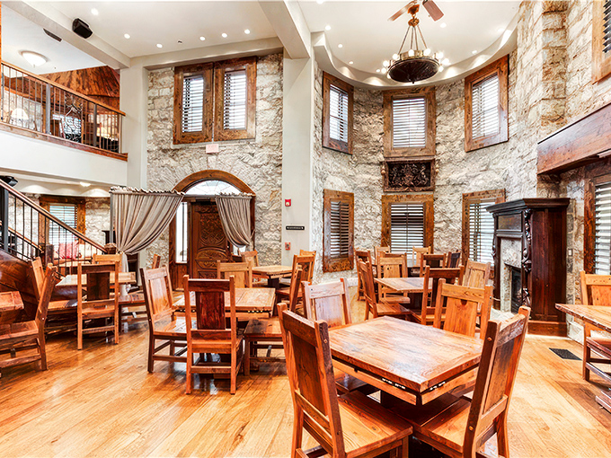 Inside these stone walls, history meets hospitality with rustic wooden tables nestled among limestone walls that whisper stories from another century.