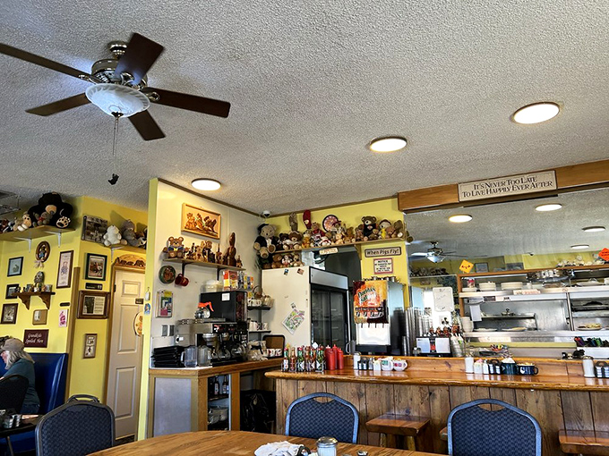Inside, yellow walls and bear collections create the coziest dining atmosphere this side of hibernation. Ceiling fans lazily spin as conversations flow.