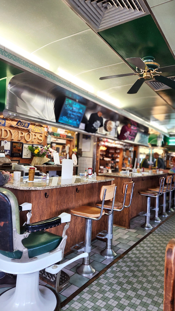 Counter seating that hasn't changed since Buddy Holly topped the charts. Those mint green vinyl stools have witnessed more breakfast conversations than a morning talk show.