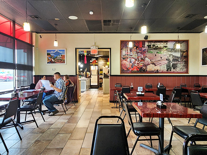 Simple tables, colorful artwork, and the promise of Guatemalan flavors create an atmosphere that's both unpretentious and irresistibly inviting.