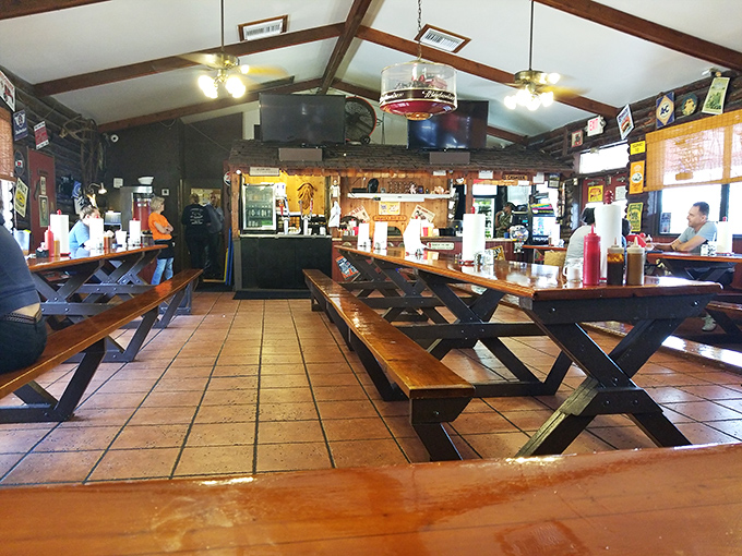 No-frills picnic tables and wood-paneled walls tell you everything you need to know—this place prioritizes meat over décor, exactly as it should.