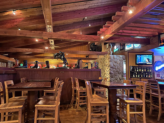 Exposed wooden beams and cowboy boots on display create that perfect "mountain lodge meets steakhouse" vibe that makes you instantly feel at home.