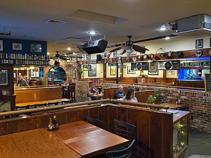 Wooden booths, brick accents, and music memorabilia create that magical sweet spot where British pub meets Virginia Beach comfort.