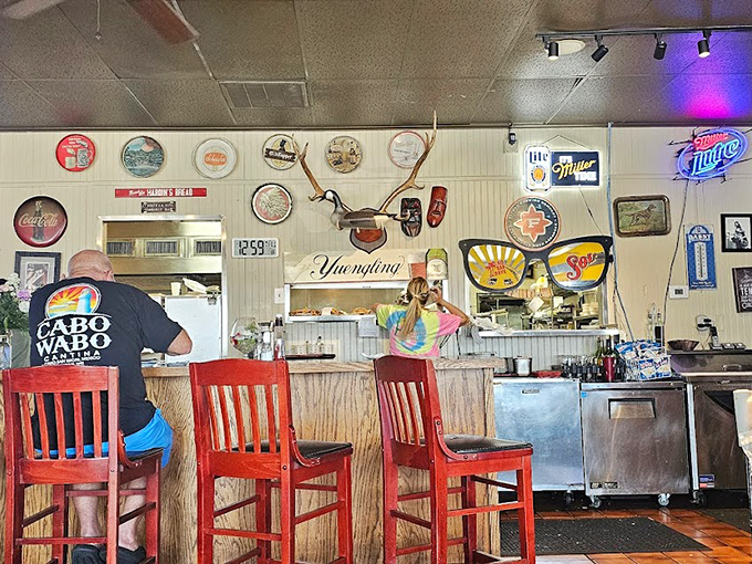 Inside, the walls tell stories that menus can't. Every beer sign, deer mount, and sports pennant represents a slice of North Little Rock culture preserved in this time capsule of comfort.