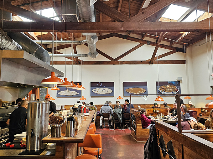 Inside, exposed beams and bright pendant lights create a space where pancake dreams come true and strangers become friends.