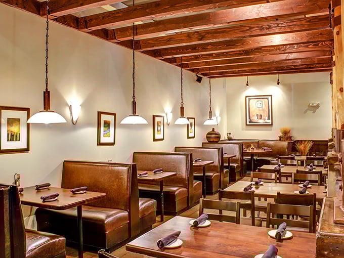 Exposed wooden beams and leather booths create that perfect "fancy yet comfortable" vibe. Like wearing your best jeans to a concert.