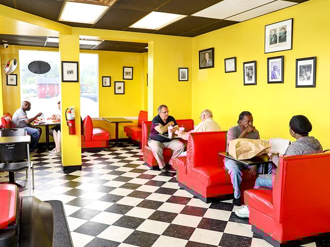 Inside, the classic checkerboard floor and red vinyl booths create a time capsule where the only thing that matters is the meat on your plate.
