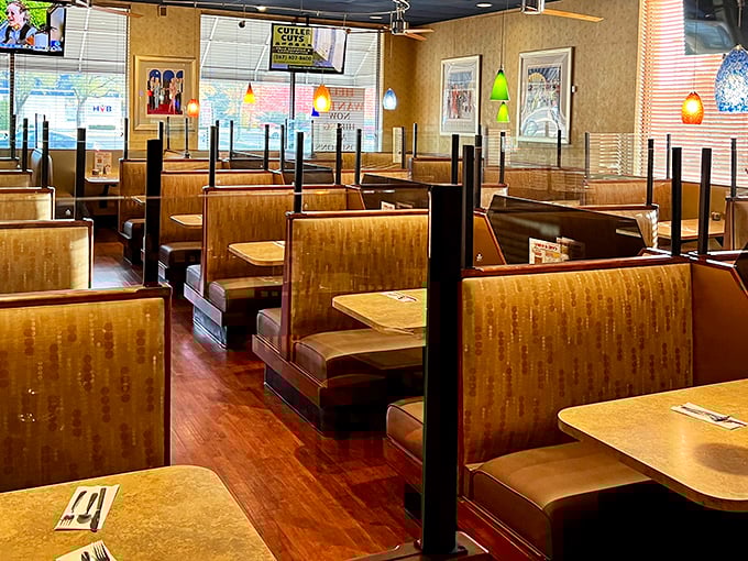 Classic deli booths where memories are made. The warm wood tones and pendant lighting create that perfect "come stay awhile" atmosphere.