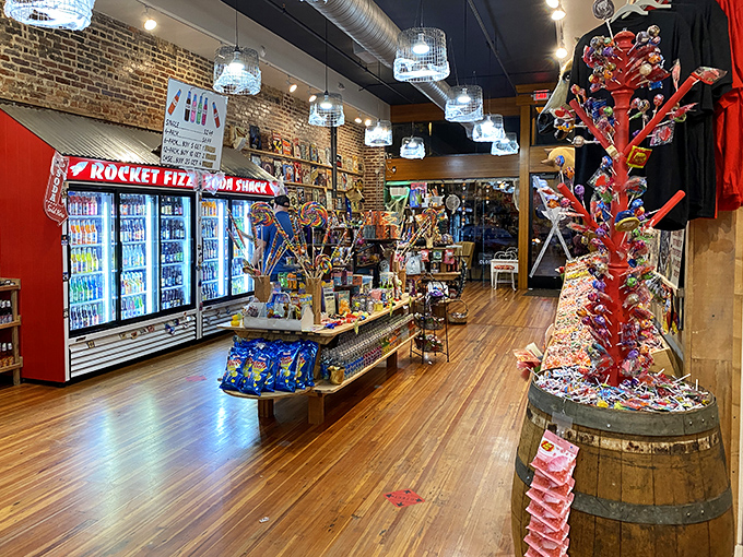 Inside, wooden barrels overflow with treats while refrigerators hum with hundreds of bottled possibilities. This isn't shopping&mdash;it's time travel with a sugar rush.