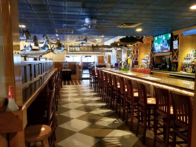 Where nautical meets gastronomical. The bar area's wood-paneled charm and checkered floor set the stage for cocktails and conversations about the catch of the day.
