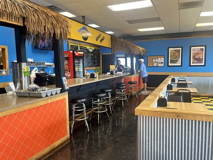 Blue walls and thatched accents create a tropical BBQ oasis that somehow makes perfect sense. It's vacation vibes with serious meat credentials.