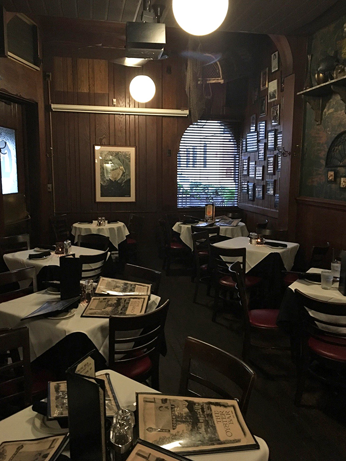 Dark wood paneling and white tablecloths create an atmosphere that whispers, "Yes, we're serious about seafood, even in Indiana."