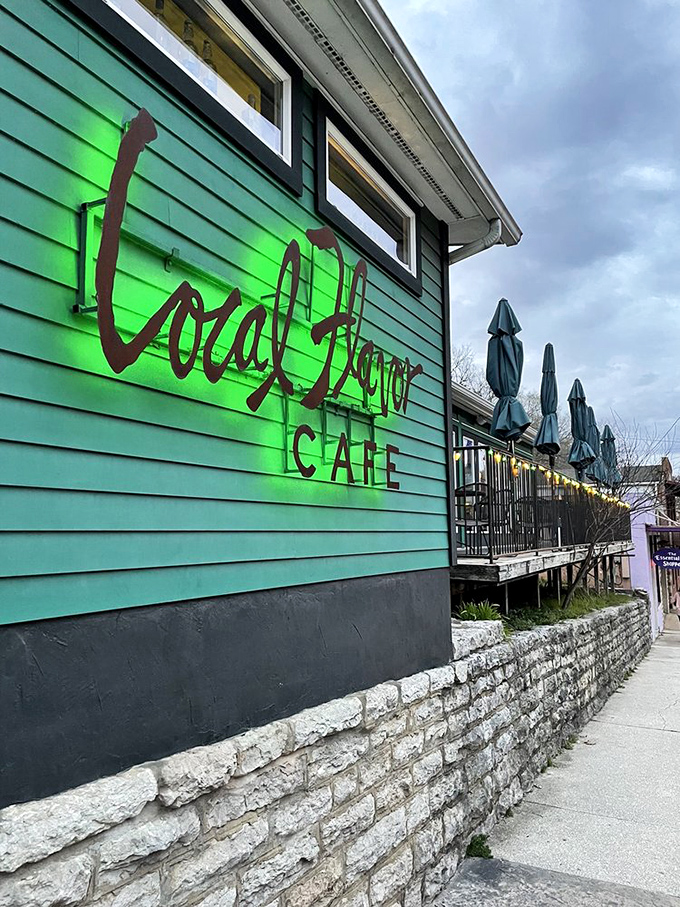 Local Flavor Café's turquoise exterior glows like a culinary beacon, promising delicious adventures from its hillside perch in Eureka Springs.