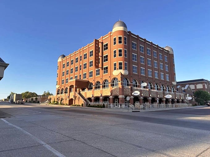 The majestic Artesian Hotel stands as Sulphur's crown jewel, its impressive architecture blending historical elegance with modern luxury in the heart of town.