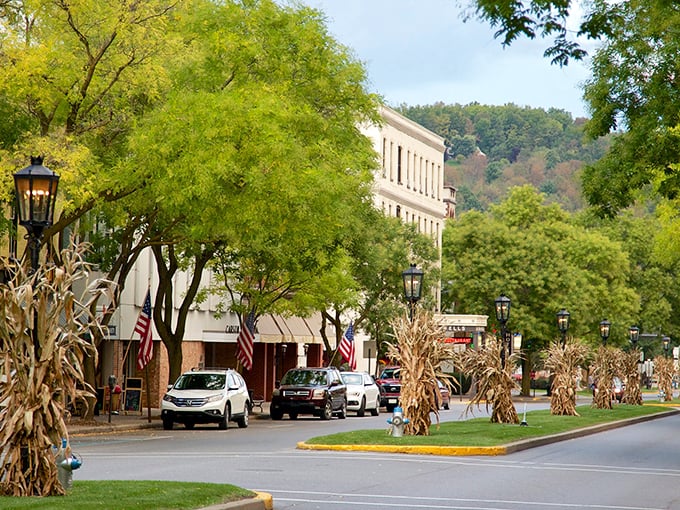 Fall decorations transform Wellsboro's already charming downtown into a harvest celebration, with American flags adding patriotic flair to the historic facades.