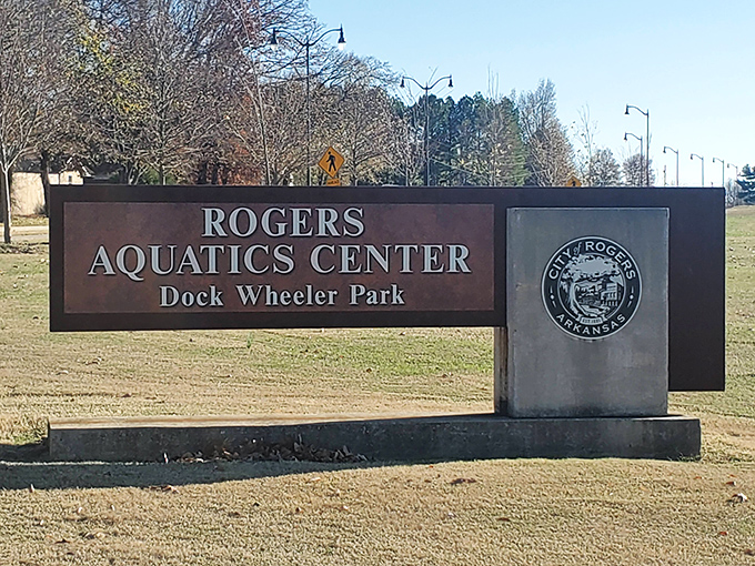 Nothing says "you've arrived" quite like a monumental sign planted firmly in winter grass. The official welcome mat to your impending chlorine-scented adventure.