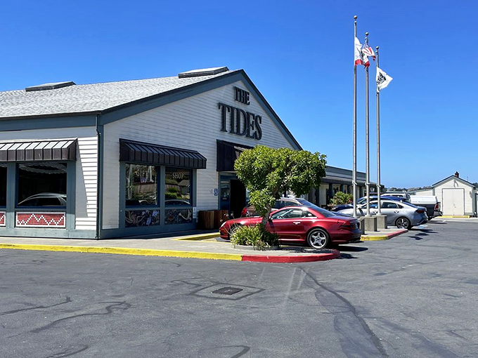 The Tides Wharf Restaurant stands proudly against the California sky, a white-washed beacon of seafood salvation for hungry travelers and locals alike.