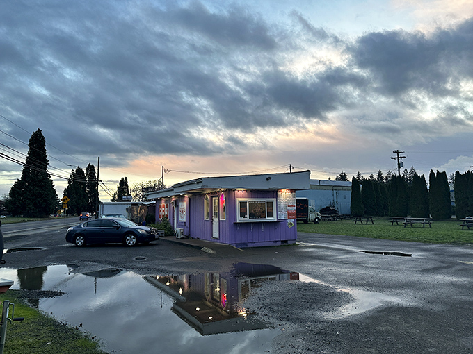 Twilight at the barbecue oasis. Even puddles reflect the magic of this unassuming spot where smoke signals call to hungry travelers.
