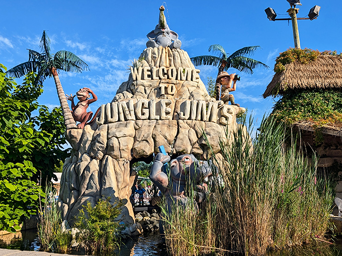 Nature meets imagination at the iconic welcome sign, where stone dinosaurs and explorers invite adventurers into Jungle Jim's whimsical world.