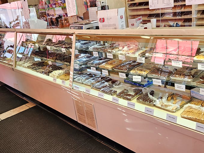 Chocolate paradise awaits behind pristine glass&mdash;where decisions become deliciously difficult and "just one piece" becomes life's biggest fiction.