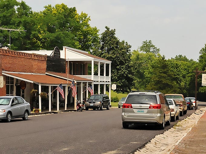 Main Street whispers tales of the Santa Fe Trail with its brick storefronts and wooden porches, where American flags flutter like living history lessons.
