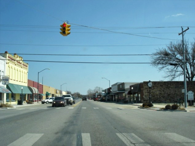 Downtown Wilburton's historic buildings stand as colorful sentinels of small-town charm, where the traffic light might be the most stressful part of your day.