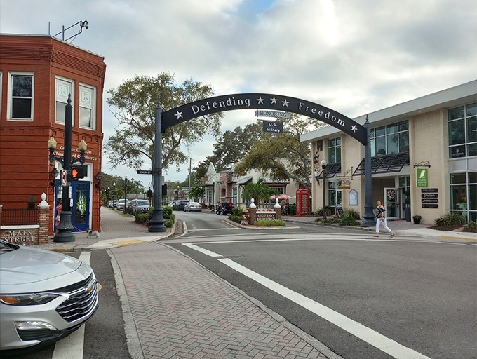 The charming entrance to downtown Dunedin invites pedestrians to stroll beneath its welcoming arch, promising Scottish heritage with a Gulf Coast twist.