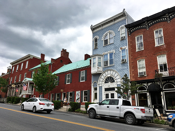 That distinctive blue building stands out like the cool kid in school who somehow gets along with everyone.
