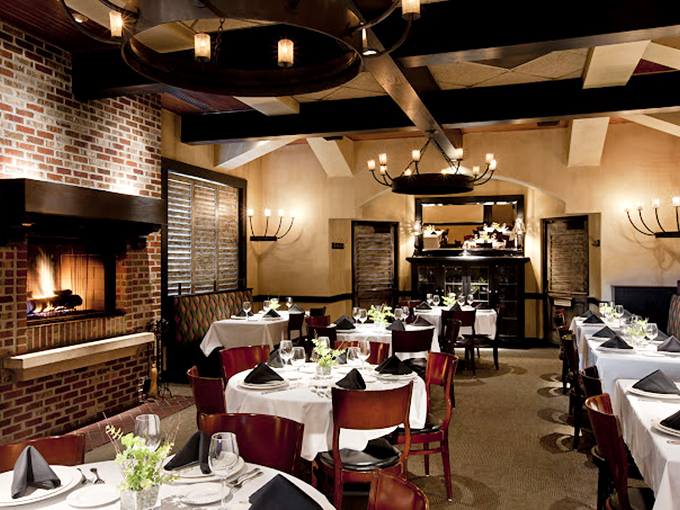 Warm brick walls, elegant chandeliers, and white tablecloths create an atmosphere that whispers "special occasion" while still making you feel perfectly at home.