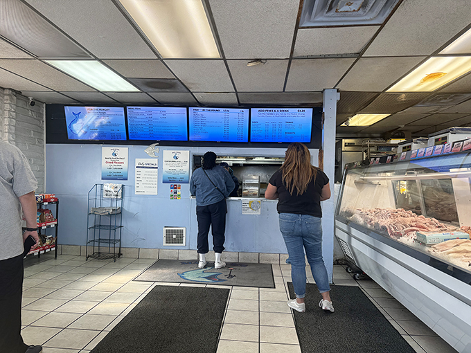 Simplicity reigns at the ordering counter where culinary magic begins. No fancy frills needed when the food does all the talking.