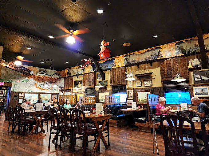 Step inside and you're transported to a sailor's dream—nautical treasures hanging from every surface, promising adventures for your taste buds.